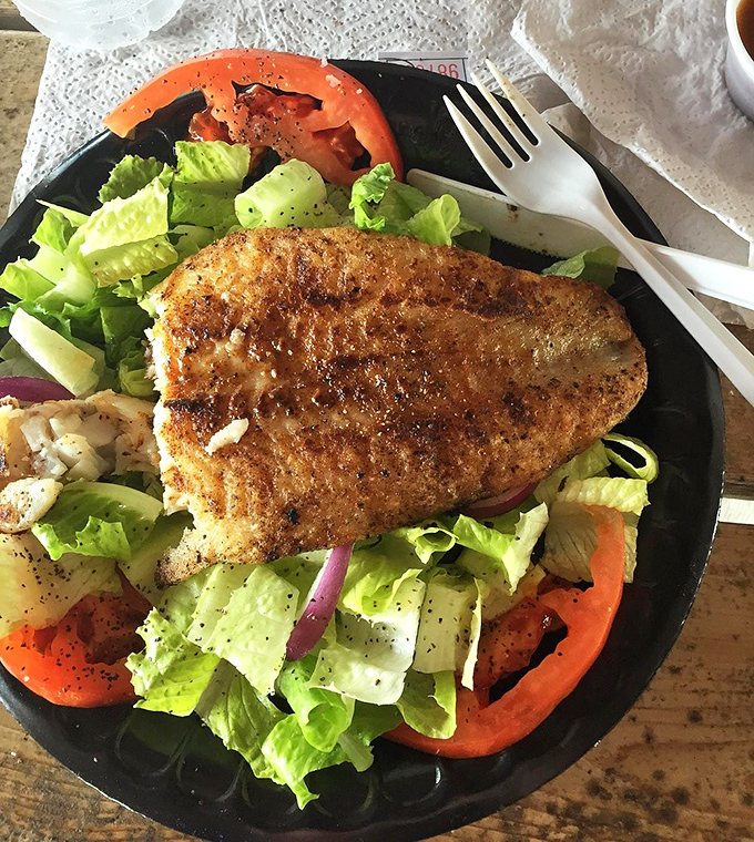 Blackened fish atop crisp greens&mdash;proof that "eating light" and "eating well" aren't mutually exclusive concepts, especially when you're this close to the water.