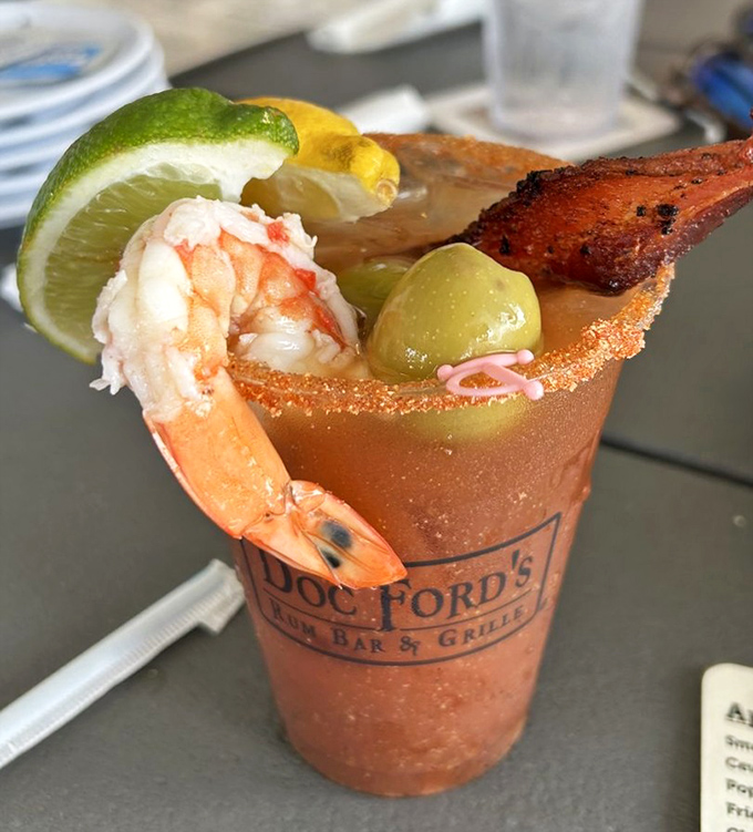 A Bloody Mary that means business, garnished like it's auditioning for a vegetable garden reality show.