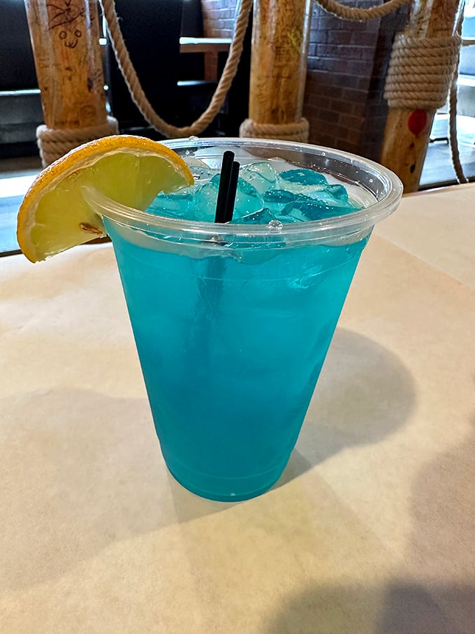 This electric blue lemonade isn't just Instagram-worthy – it's the perfect cool counterpoint to the spicy seafood heat. Ocean-colored refreshment!