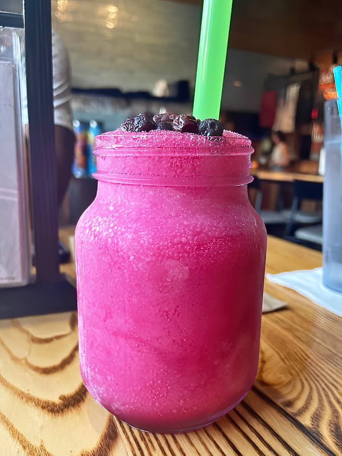 This isn't just a drink, it's a vibrant purple statement piece &ndash; a blueberry moonshine concoction that's as photogenic as it is dangerously delicious.