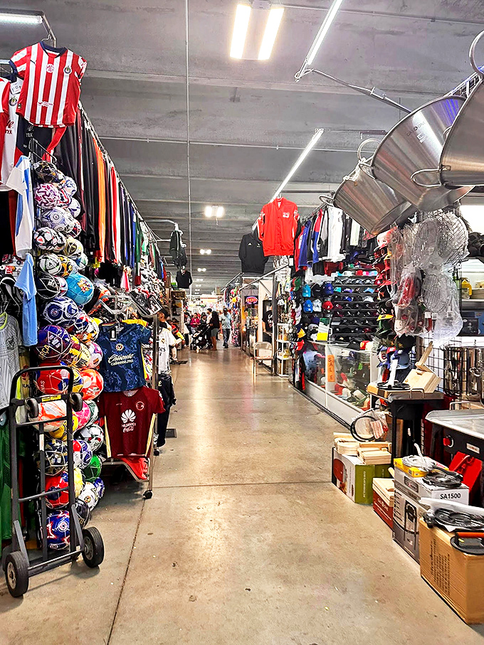 A corridor of sports jerseys creates a textile timeline of athletic loyalties. Your team's colors are waiting somewhere in this fabric forest.