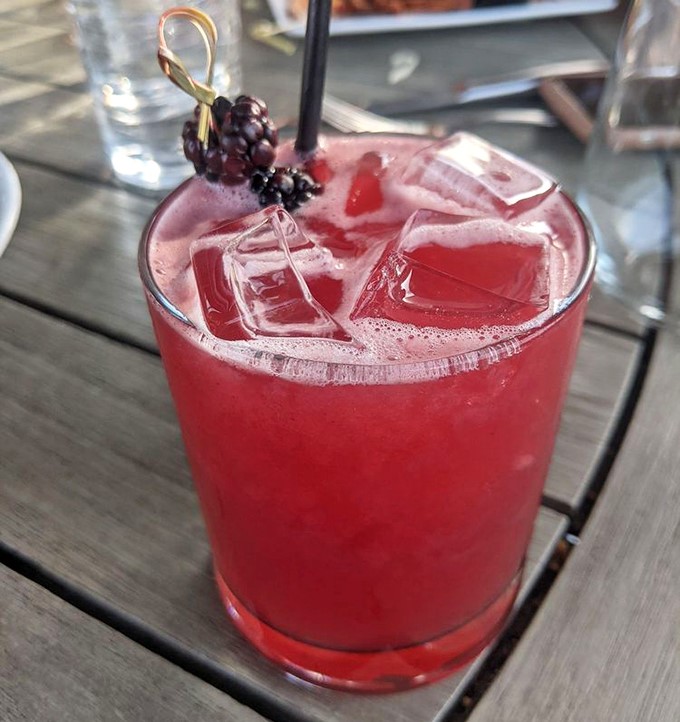 This vibrant cocktail, garnished with fresh berries, isn't just a drink&mdash;it's summer in a glass, regardless of what season it actually is outside.