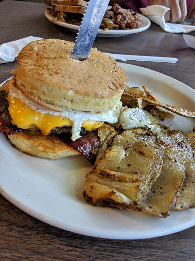 When breakfast and lunch collide on one glorious bun, topped with an egg that's practically winking at you.