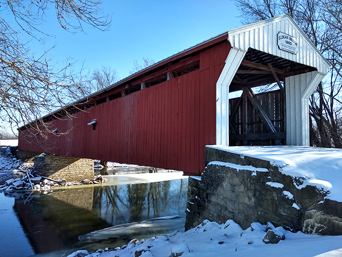 Winter transforms the Eldean Bridge into a scene worthy of the best holiday cards&mdash;snow-dusted approaches and the contrast of red against white.