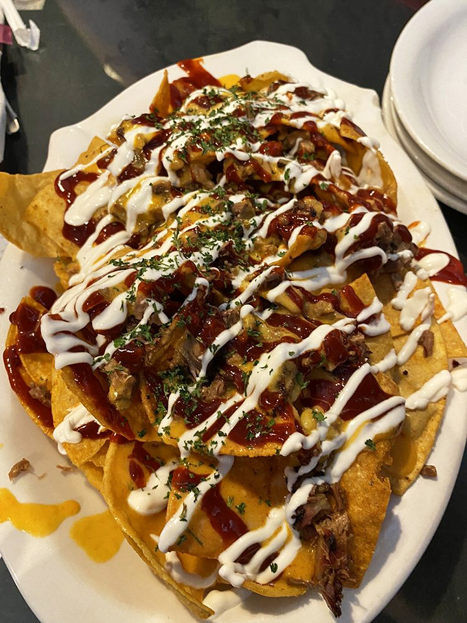 These aren't your average nachos &ndash; they're a barbecue masterpiece disguised as bar food, complete with artistic sauce drizzles.