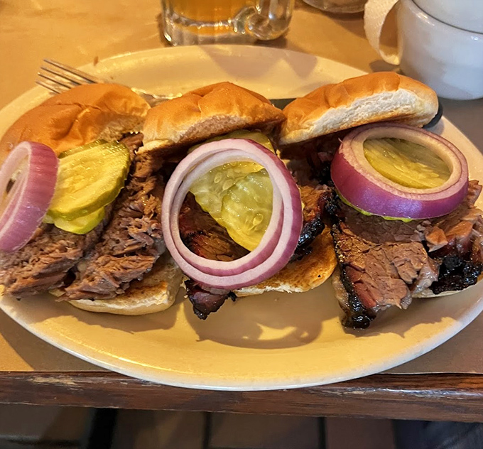 These brisket sliders tell a story of smoke, patience, and pickle perfection. The red onion adds just the right sharp counterpoint.