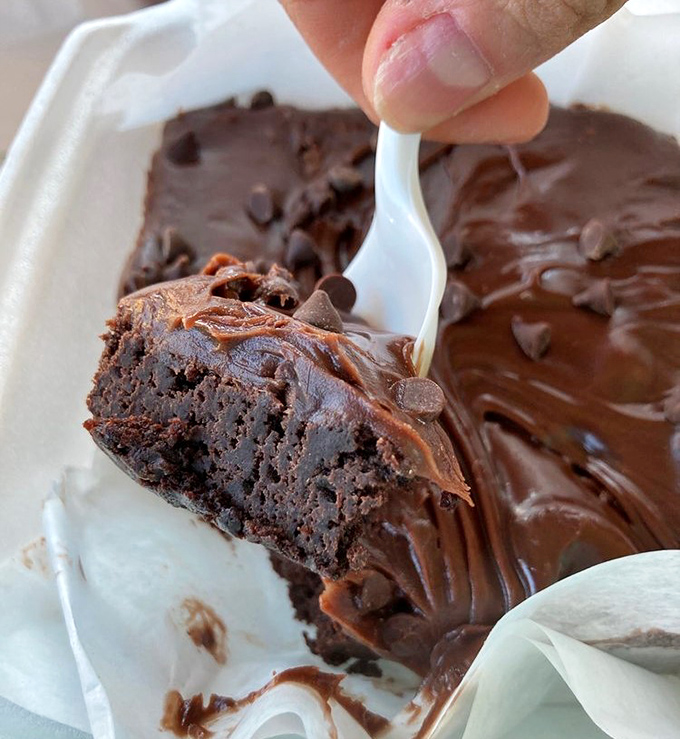 This brownie isn't just dessert, it's a chocolate revelation with a fudgy center that makes time stop with each blissful bite.