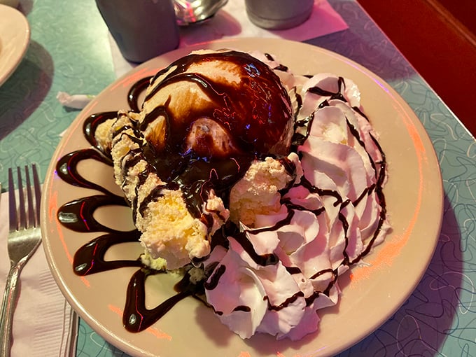 A brownie sundae that doesn't whisper sweet nothings but shouts them—ice cream melting into warm chocolate like a delicious surrender.