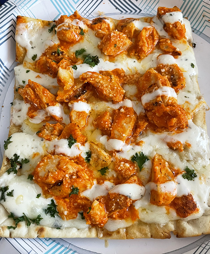 Buffalo chicken pizza that doesn't know whether it's bar food or Italian cuisine, so it decided to be the best of both worlds.