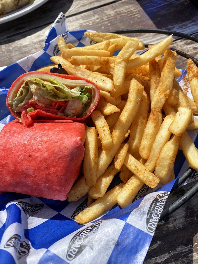Golden fries surround a wrap that's practically glowing red&mdash;like a delicious sunset you can eat without getting sand between your toes. 