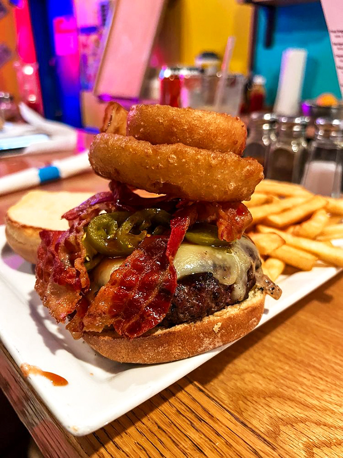 A burger that's clearly overheard all the crab cake praise and said, "Hold my beer." Note the onion rings as a power move.