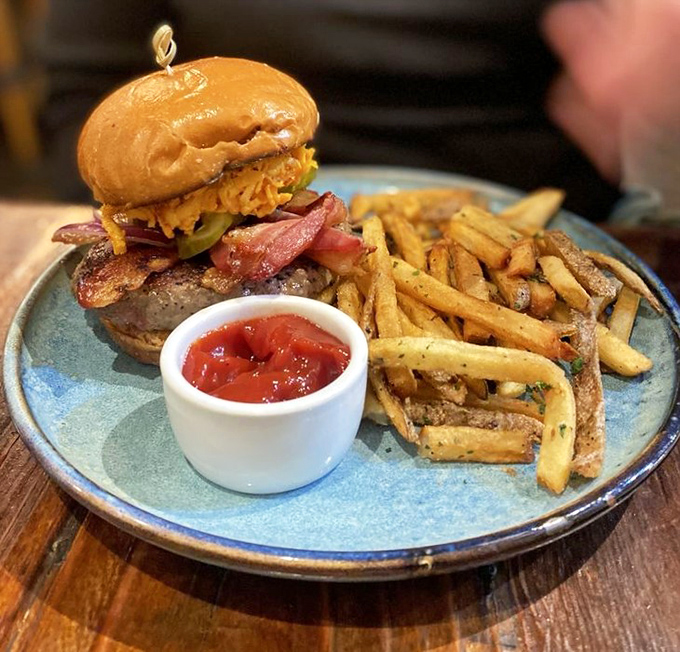 This burger doesn't need a fancy name&mdash;just look at those perfectly golden fries, the melty cheese, and that glistening bacon. Napkins required, regrets impossible.