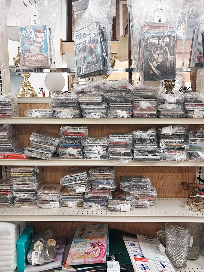 Media treasure trove! Wrapped DVDs and CDs stand like archaeological artifacts of entertainment history, waiting for nostalgic collectors to discover.