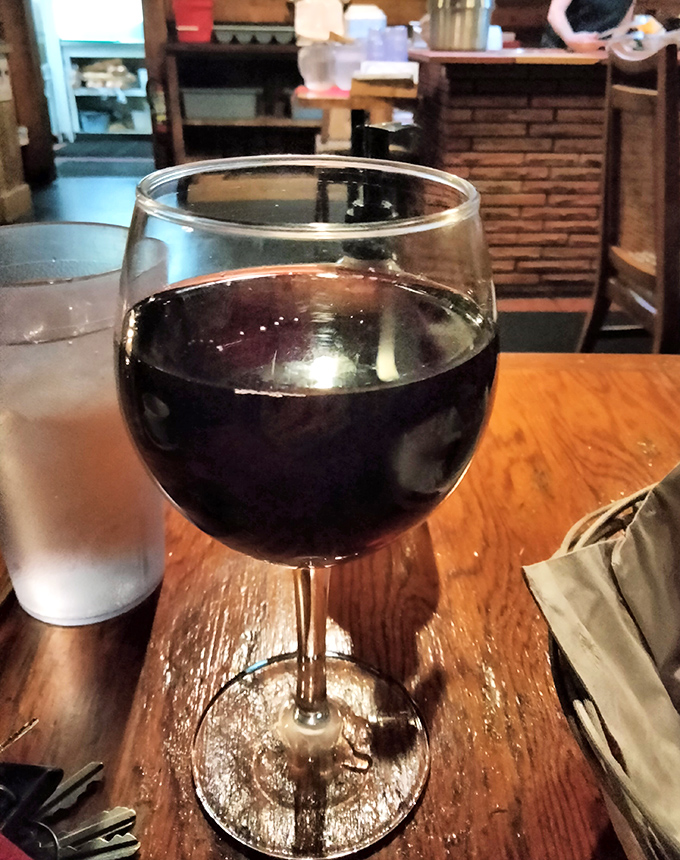 A generous pour of Cabernet Sauvignon catching the light just right&mdash;because every great steak deserves a worthy dance partner.