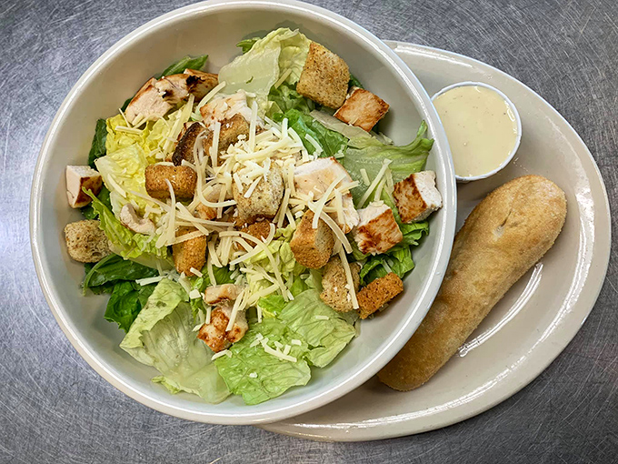Even salad skeptics might convert after this Caesar. Fresh greens, perfectly toasted croutons, and that creamy dressing create the rare salad worth getting excited about.