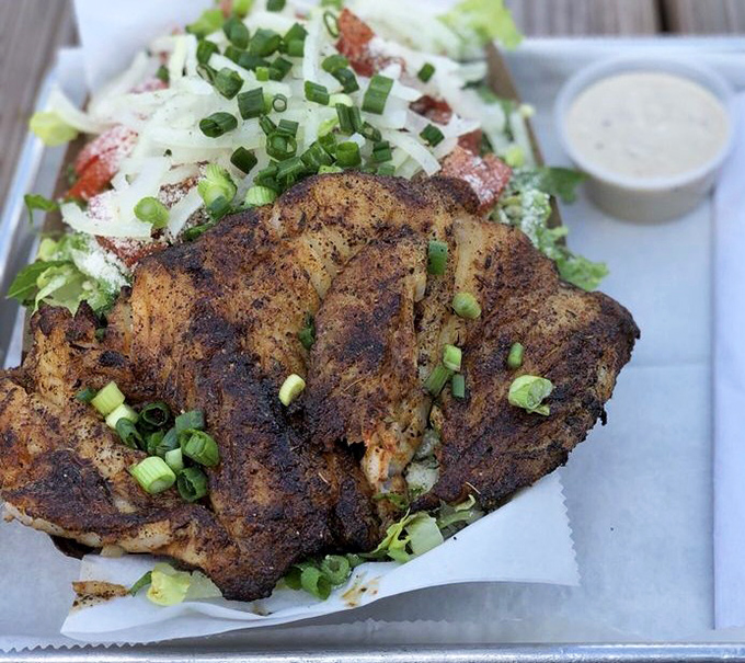 Blackened grouper transforms a simple Caesar salad into something worthy of a standing ovation.