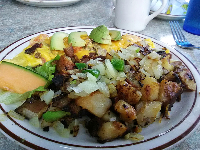Breakfast alchemy at its finest&mdash;potatoes crisped to golden perfection alongside an omelet that's practically bursting with California sunshine.