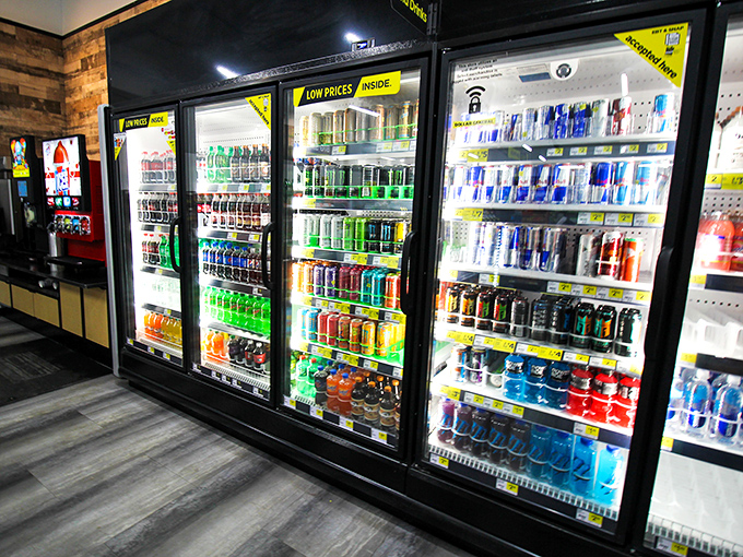 The beverage coolers glow like the refrigerator at midnight when you're trying not to wake anyone during your snack raid. Cold refreshment awaits.
