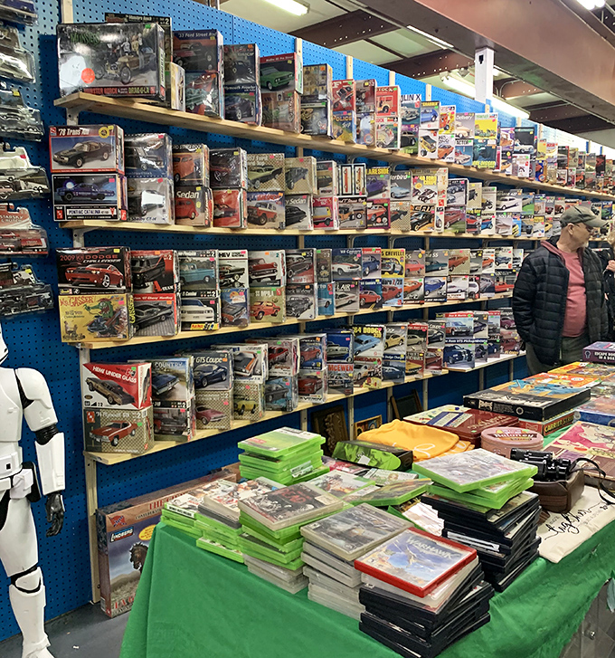 Model car nirvana where grown men suddenly remember every vehicle they couldn't afford in their youth. Miniature dreams behind perfectly polished glass.