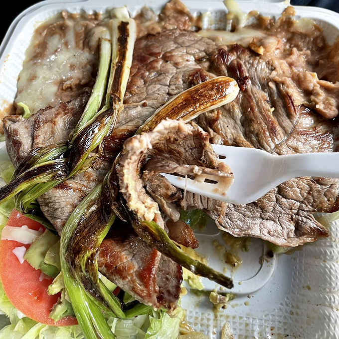 Carne asada so perfectly grilled, those charred green onions aren't garnish &ndash; they're backup dancers for the meat's main performance.