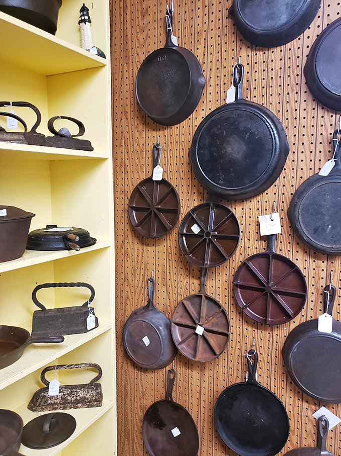 Cast iron paradise where seasoned skillets hang like badges of honor. These kitchen workhorses have flipped more pancakes than IHOP on National Pancake Day.