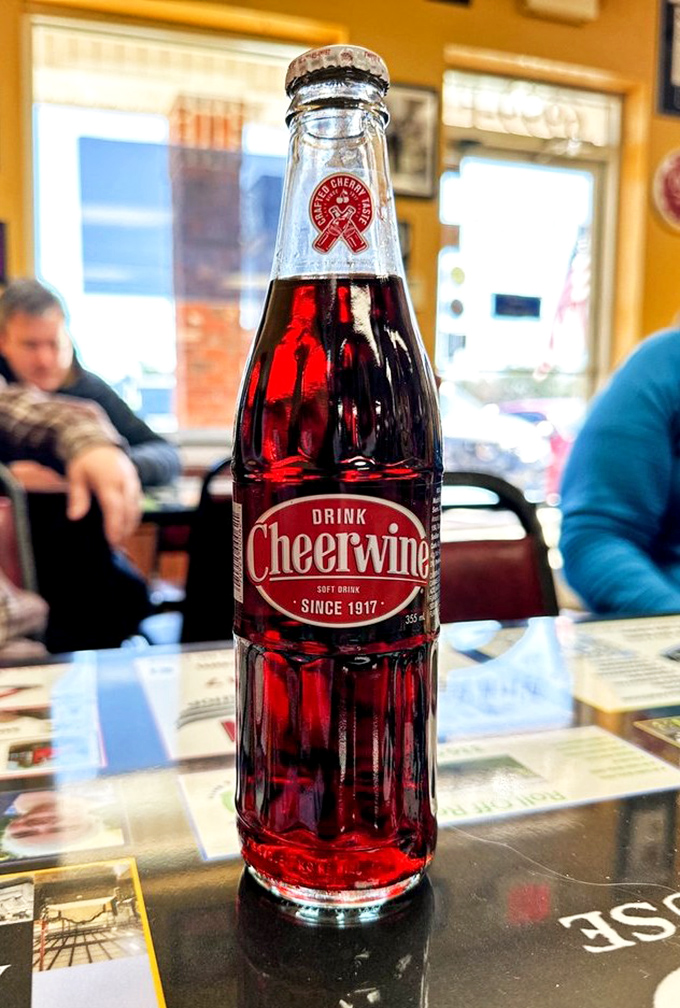A bottle of Cheerwine &ndash; North Carolina's ruby-red answer to cola that pairs with burgers like Sinatra paired with a microphone.