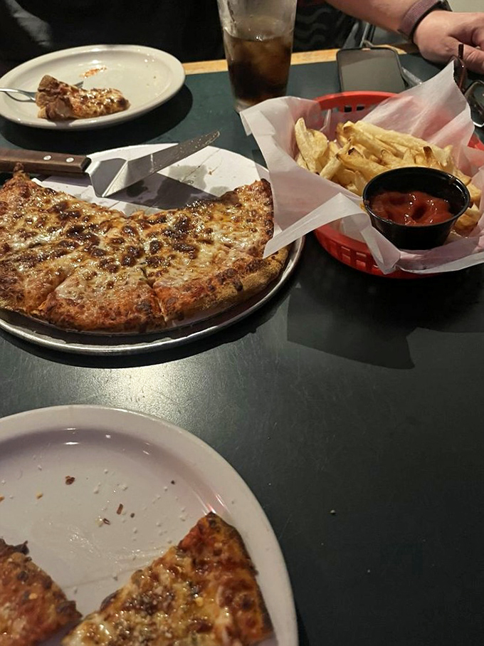 Simple pleasures done right deserve standing ovations. This cheese pizza proves that sometimes the classics don't need reinvention—just perfect execution.