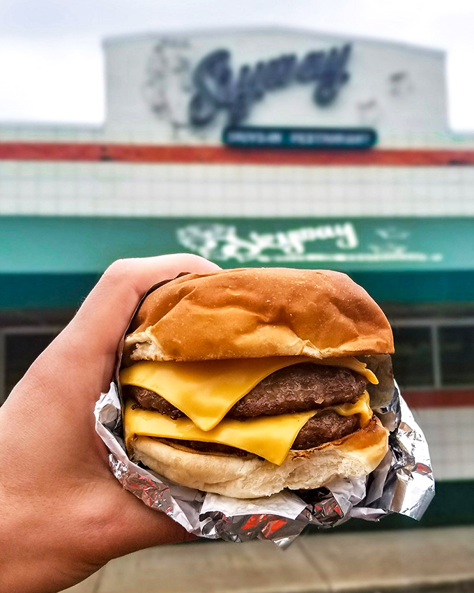 The cheeseburger in its natural habitat &ndash; posed against the Skyway sign, this beauty has more personality than most dating app profiles.