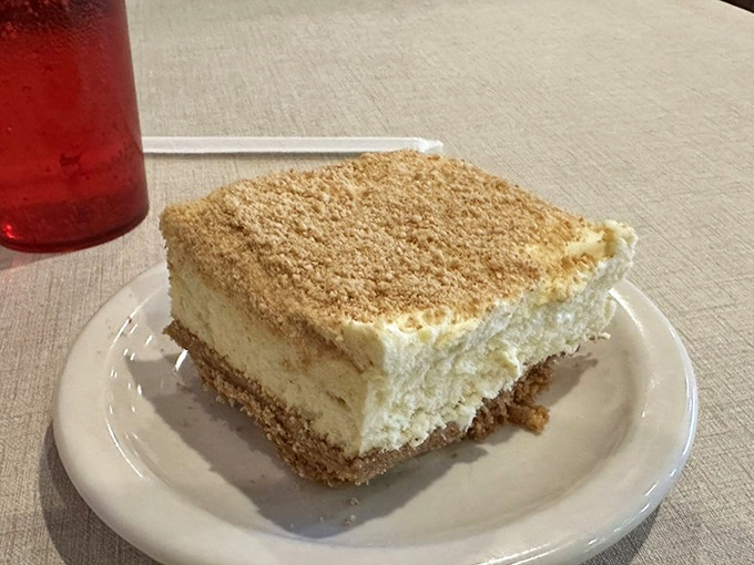 The cheesecake that launches a thousand diet breaks. Light, creamy, with a graham cracker crust that provides the perfect textural counterpoint to the velvety filling.