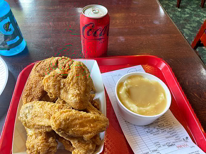 The perfect pairing: golden fried chicken and an ice-cold Coca-Cola. Some combinations are timeless for good reason.