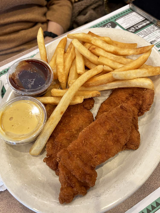 Golden chicken fingers that remind you why comfort food earned its beloved place in American hearts.