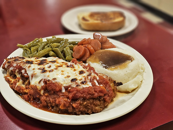 Even the lunch offerings command respect—this chicken parmigiana with mashed potatoes and green beans would make any Italian grandmother nod in approval.