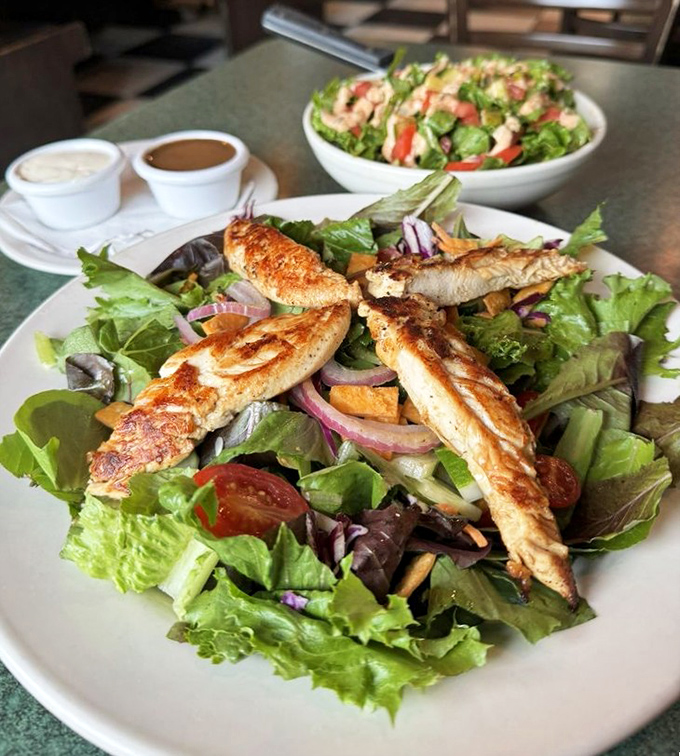 A salad that doesn't apologize for being healthy because those perfectly grilled chicken strips are stealing the spotlight anyway.
