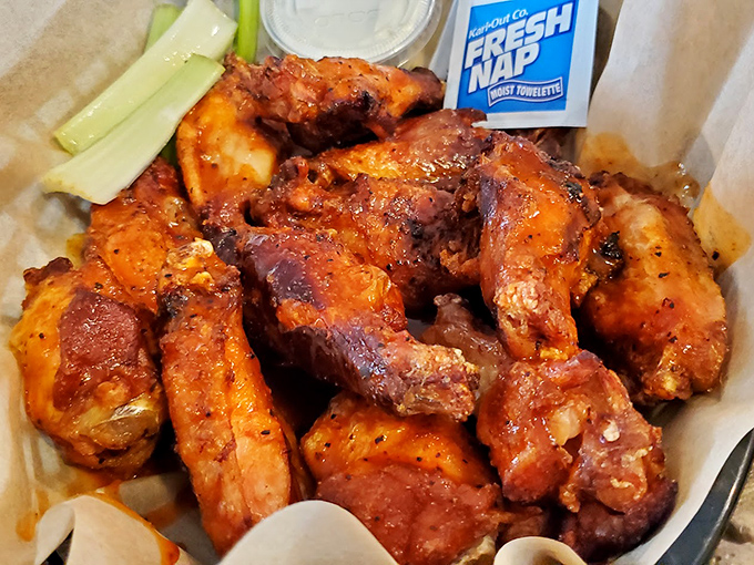 Wings that make you wonder why buffalo ever got all the glory. These smoky beauties have been slow-dancing with hickory smoke for hours.