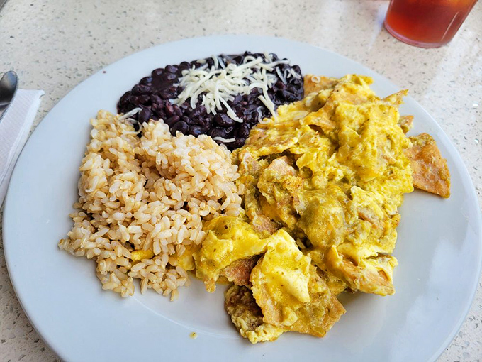 Chilaquiles: where breakfast meets south-of-the-border flair. Rice, beans, and eggs mingle in a dish that makes morning meetings infinitely more bearable.