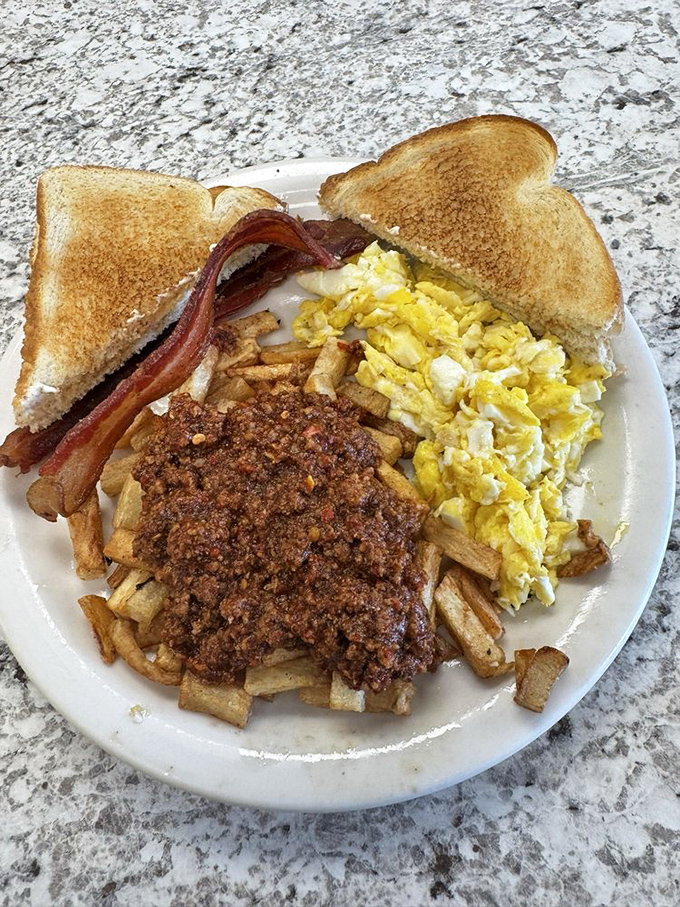 Chili-topped home fries, scrambled eggs, and toast&mdash;the breakfast equivalent of a warm hug from your favorite aunt who always sneaks you extra dessert.