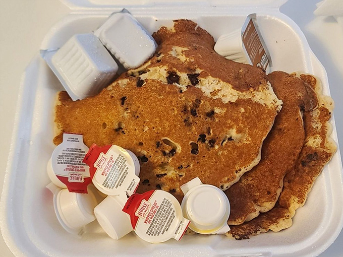 Chocolate chip pancakes that make you question why anyone bothers with fancy brunch spots charging triple for half the satisfaction.