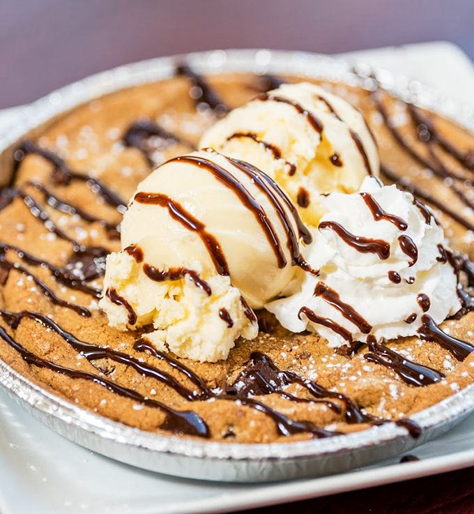 Dessert nirvana achieved: a warm chocolate chip cookie skillet topped with ice cream that melts into all the right places.