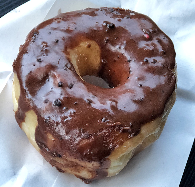 The chocolate donut&mdash;where childhood dreams and adult cravings meet in perfect harmony. That glaze has more shine than my first car.