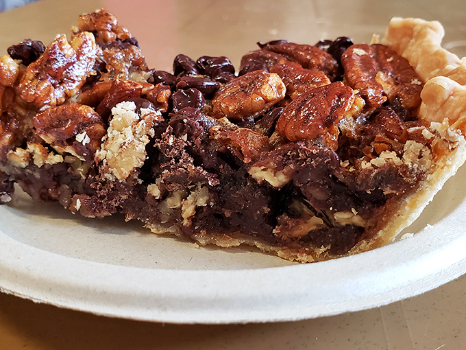 This chocolate pecan pie isn't just dessert; it's the kind of sweet finale that makes you contemplate ordering a second slice before finishing the first.