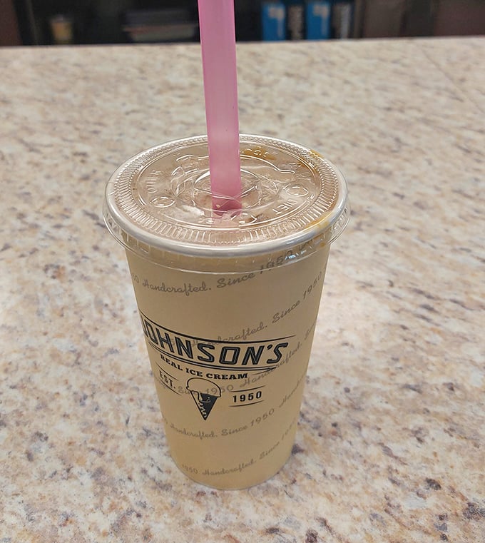 That milkshake isn't just thick&mdash;it's contemplating a career in solid food. The pink straw stands at attention, ready for your serious sipping commitment.