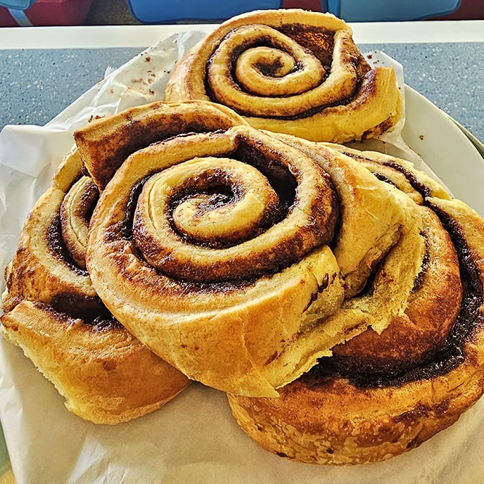 Cinnamon rolls the size of your fist, with spirals so hypnotic they could qualify as therapeutic visual aids.