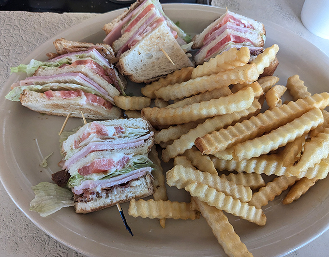 The club sandwich&mdash;architecture you can eat, with layers so precisely stacked they'd make Frank Lloyd Wright put down his blueprints and pick up a fork.