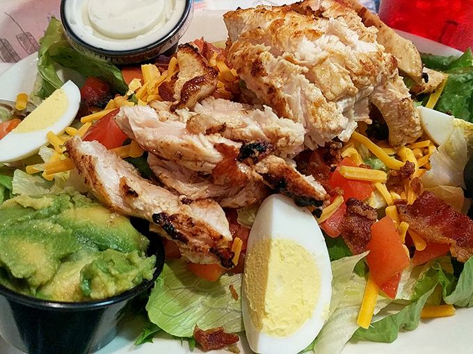 A salad that doesn't apologize for being delicious. Grilled chicken, avocado, and bacon prove healthy-ish can still be indulgent.