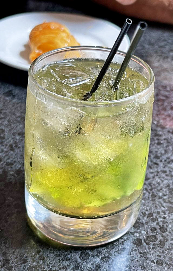 This isn't just a cocktail – it's liquid sunshine in a glass, perfectly balanced and dangerously sippable. The garnish isn't decoration, it's foreshadowing.