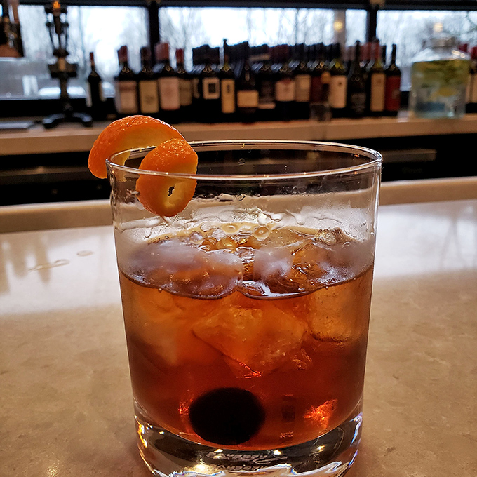 An Old Fashioned with a twist of orange&mdash;because sometimes you need something stronger than wine to wash down all those carbs.