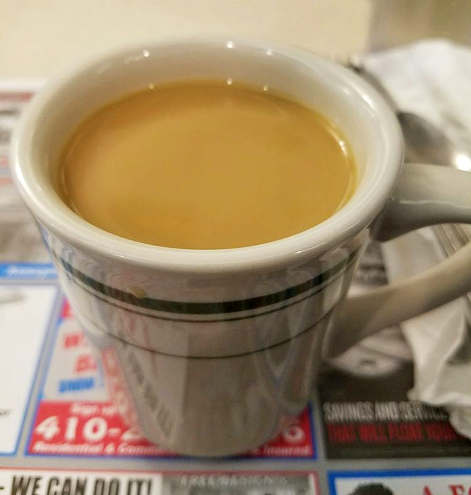 The humble diner coffee cup&mdash;holding the elixir that transforms morning zombies into functioning humans. Simple, strong, and surprisingly profound.