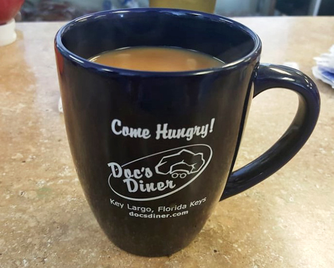 Their coffee mugs tell you exactly what to do—"Come Hungry!"—solid advice for a place where portion control is blissfully ignored.