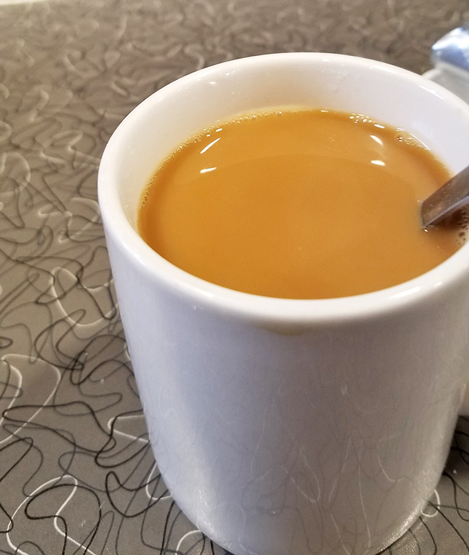 That perfect amber coffee color tells you everything about the quality brewing in this classic American diner cup.