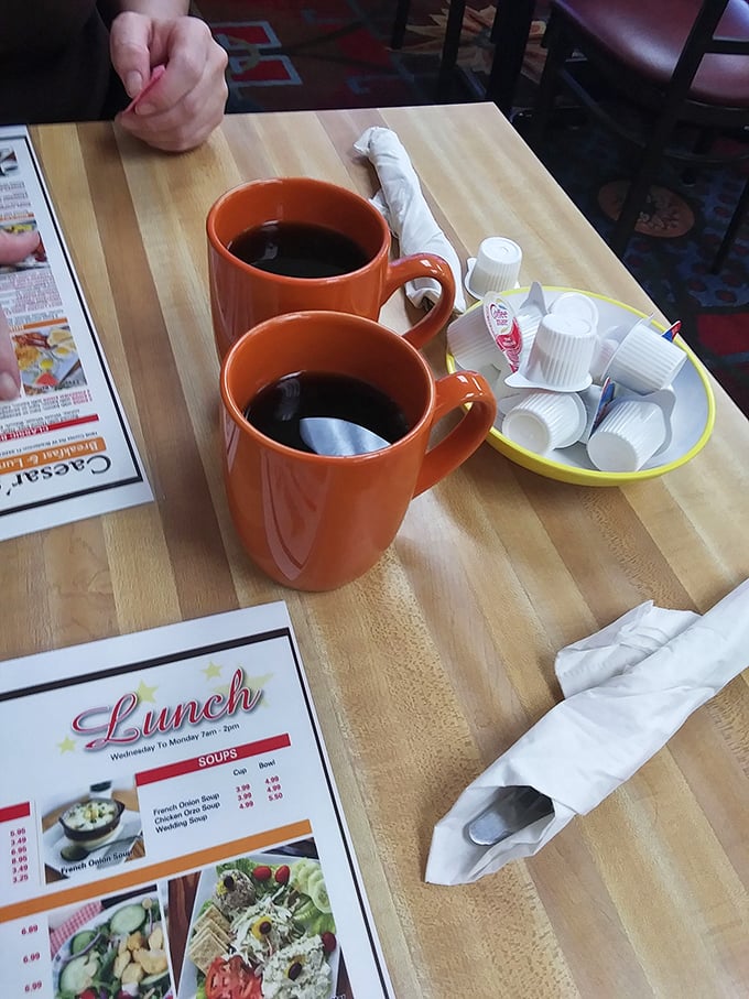 Those bright orange mugs aren't just serving coffee—they're delivering liquid motivation in generous portions. Refills encouraged!